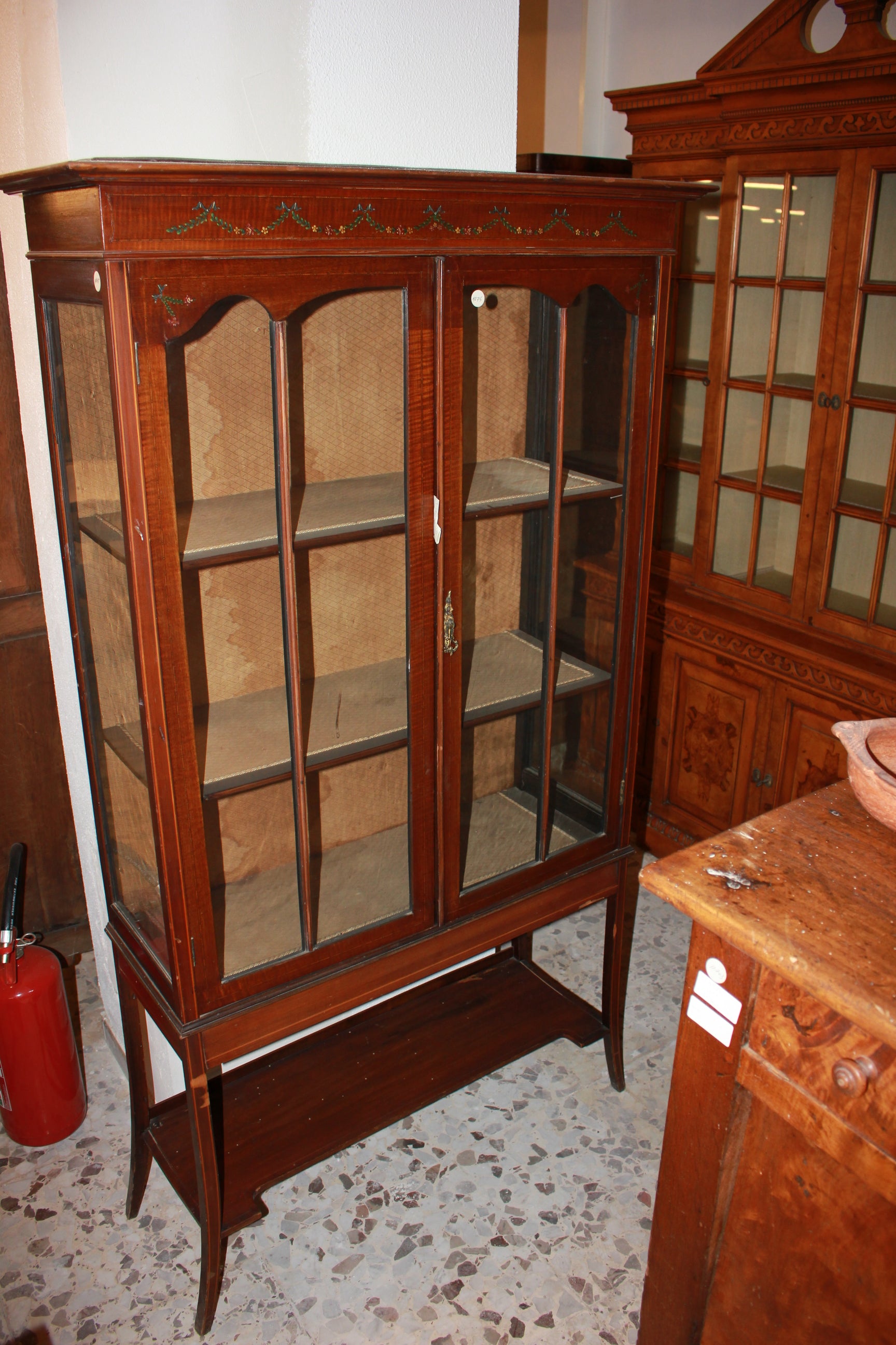 Victorian display cabinet from the 1800s with 2 doors, paintings, and